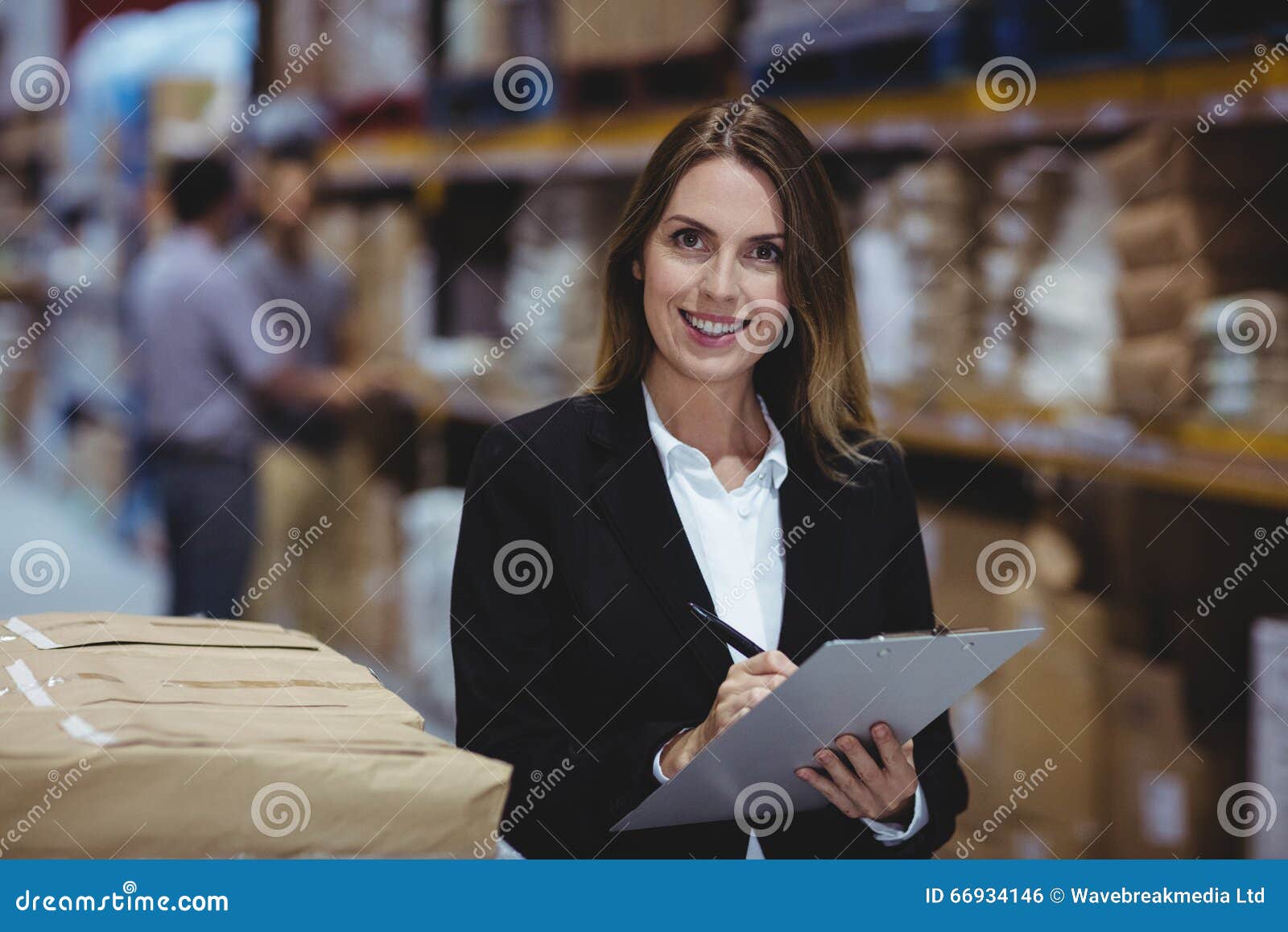 Warehouse Manager Writing on Clipboard Stock Photo - Image of ...