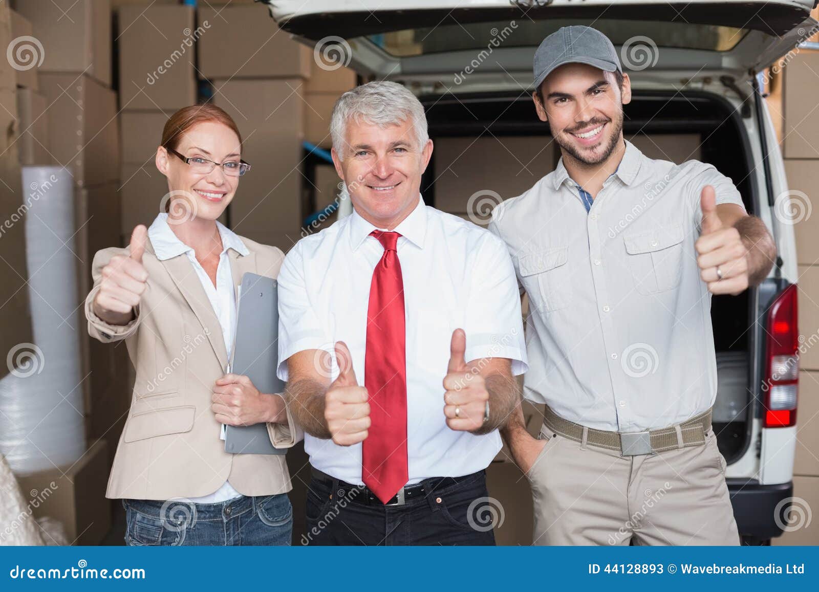 Warehouse Managers and Delivery Driver Smiling at Camera Stock Image ...
