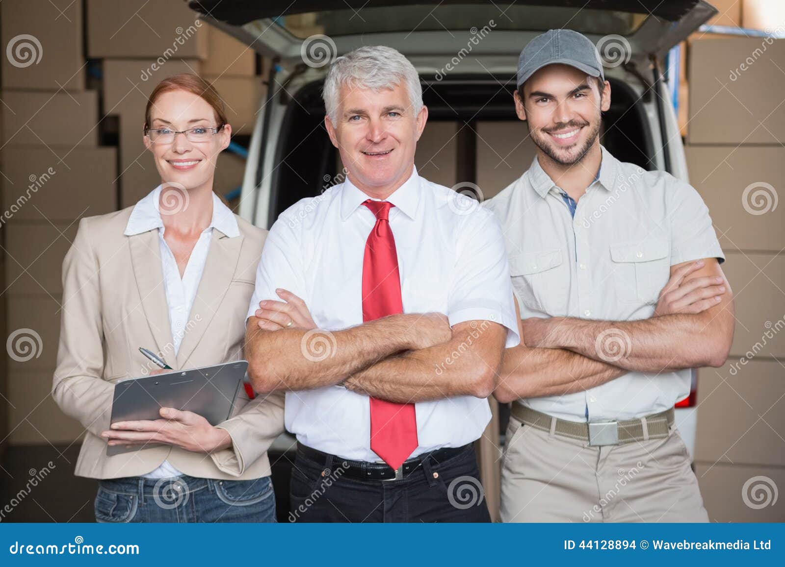 Warehouse Managers and Delivery Driver Smiling at Camera Stock Photo ...