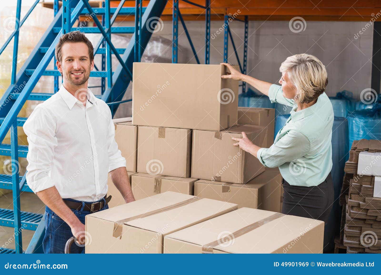 Warehouse Managers Loading a Trolley Stock Image - Image of happy, male ...