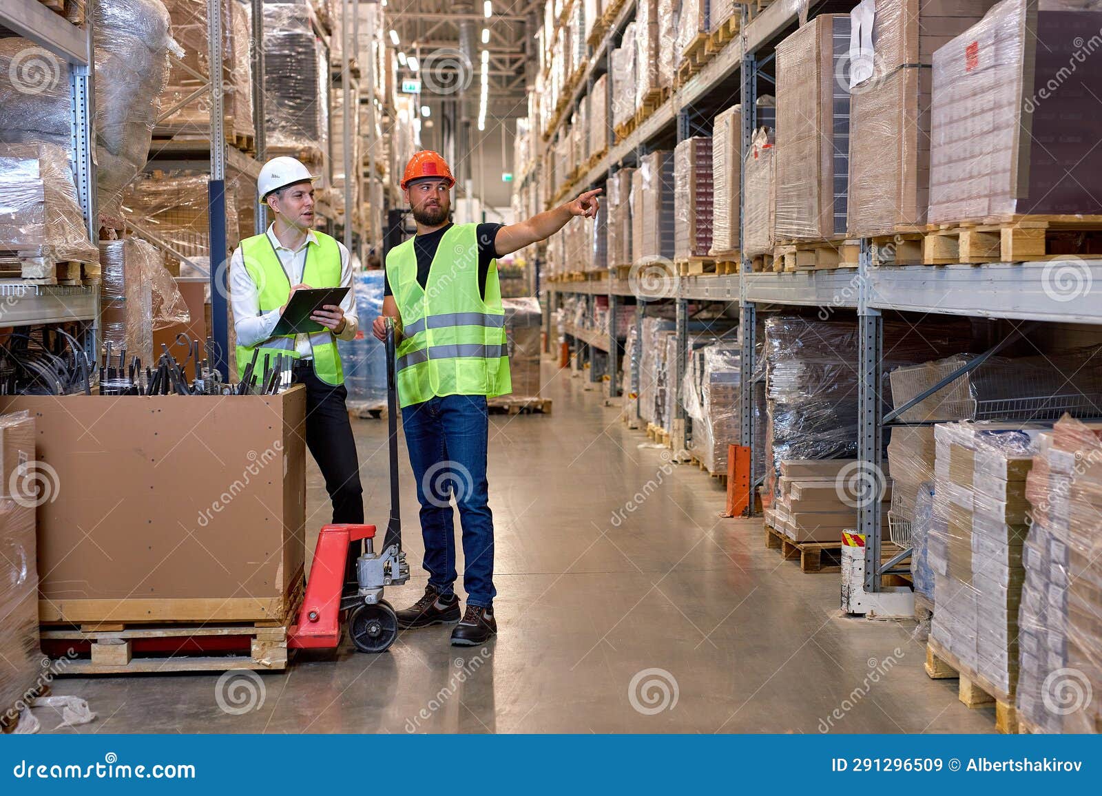 Warehouse Managers Walking through Large Warehouse Distribution Center ...