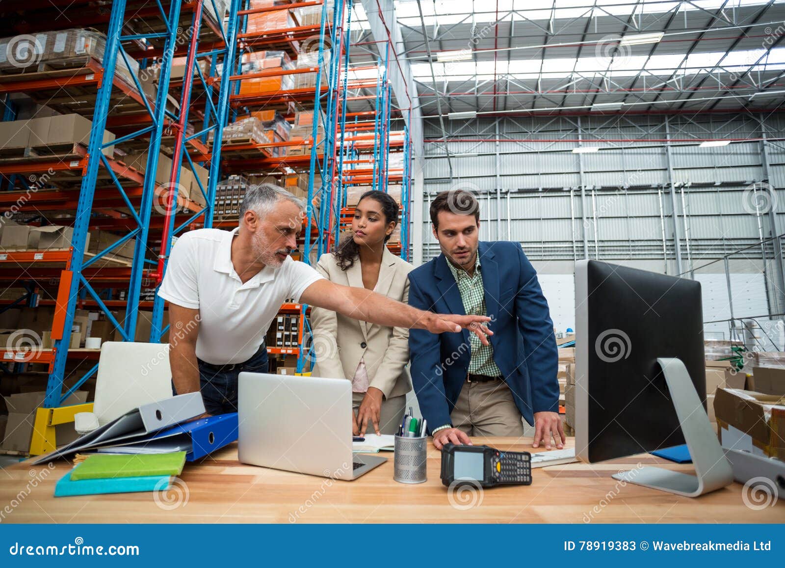 Warehouse Managers and Worker Discussing with Computer Stock Image ...