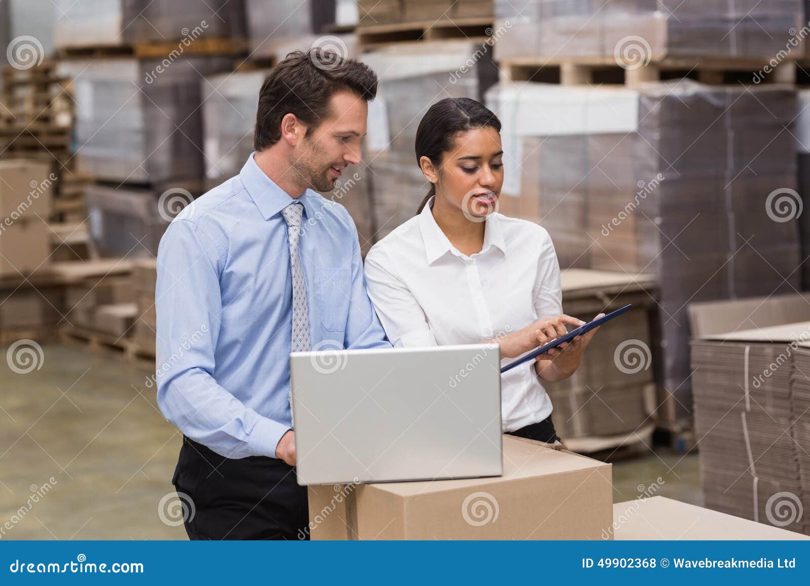 Warehouse Managers Working on Laptop Stock Photo - Image of computer ...