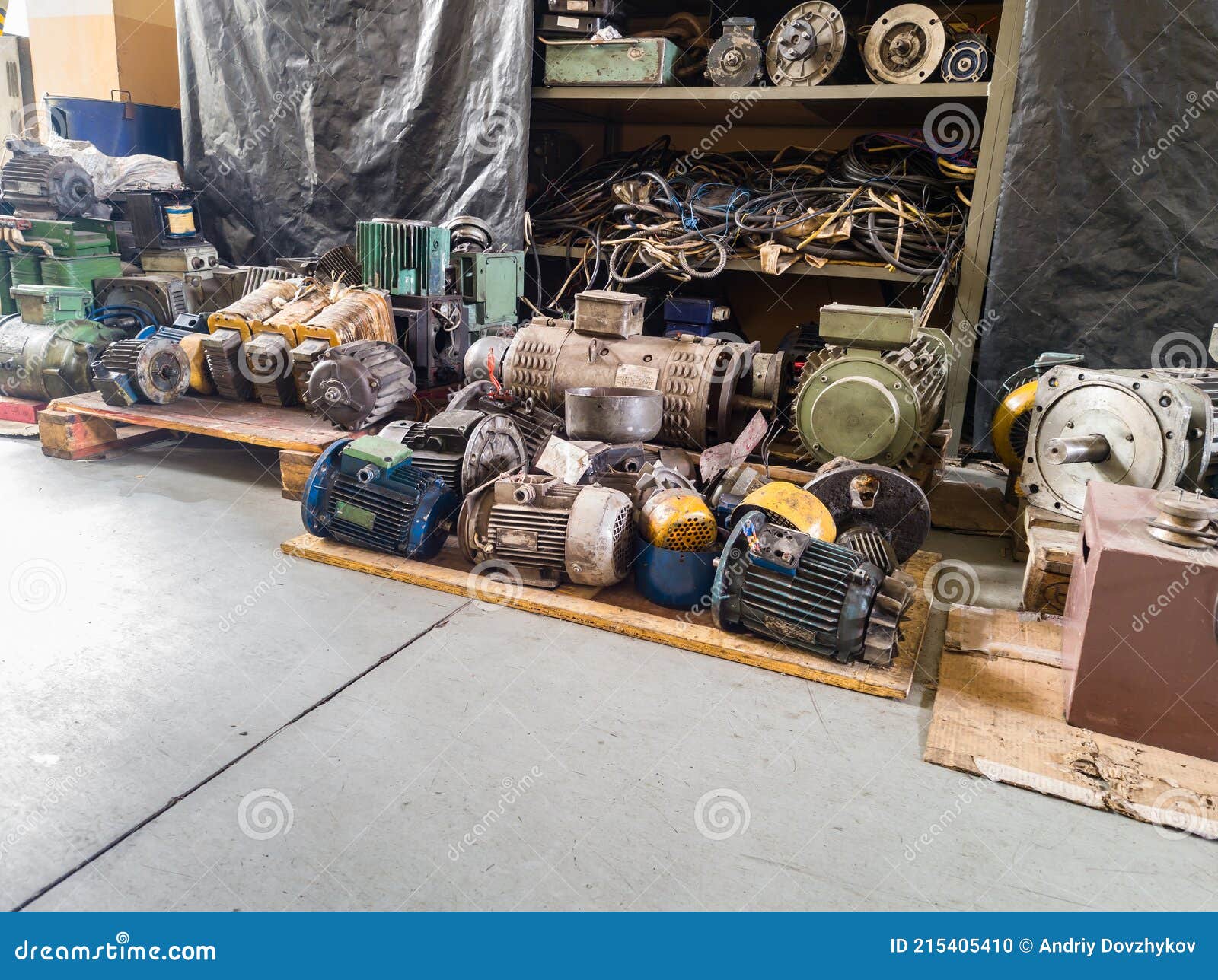 Warehouse of Old Non-working Electric Motors on Racks and on the Floor ...