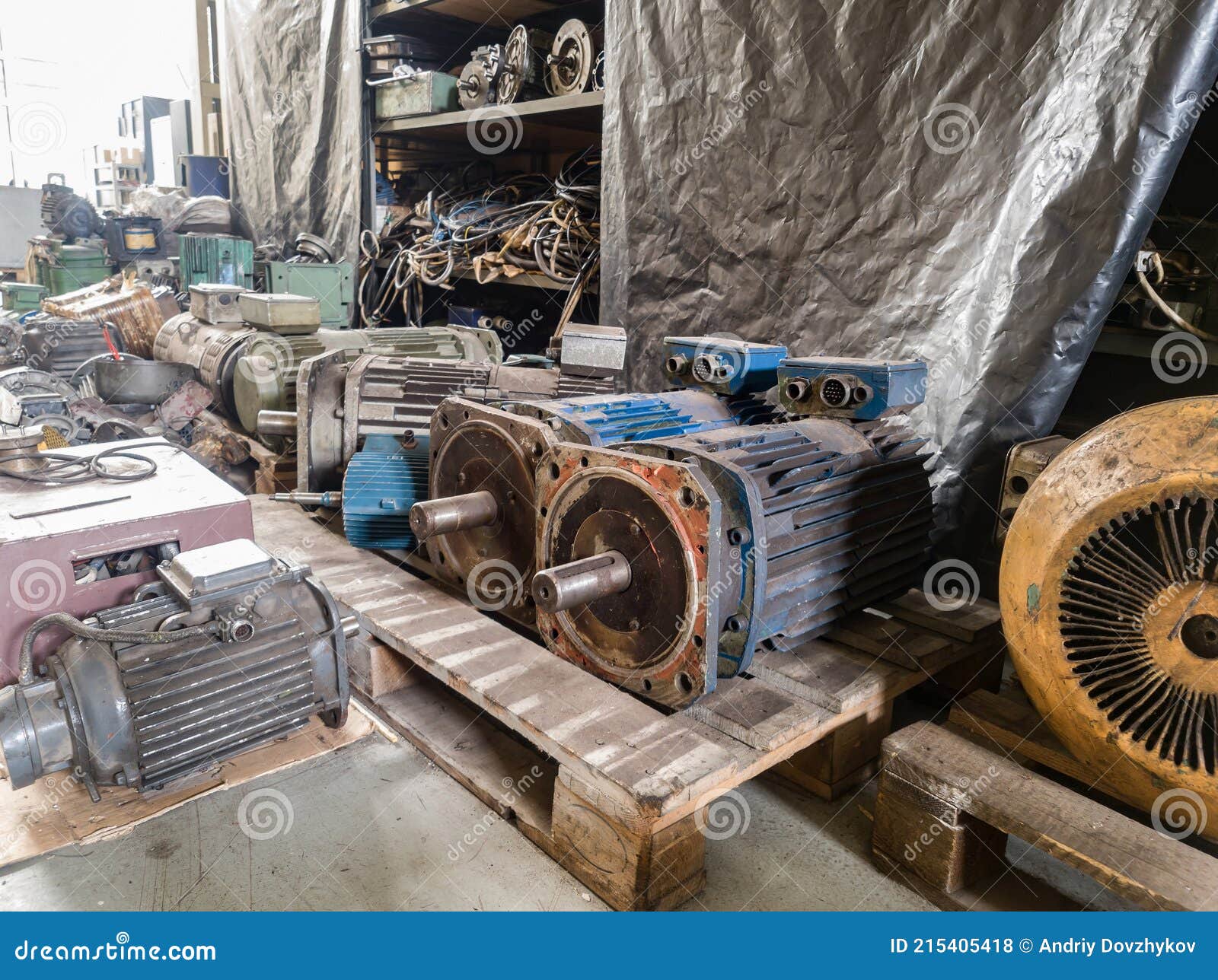 Warehouse of Old Non-working Electric Motors on Racks and on the Floor ...
