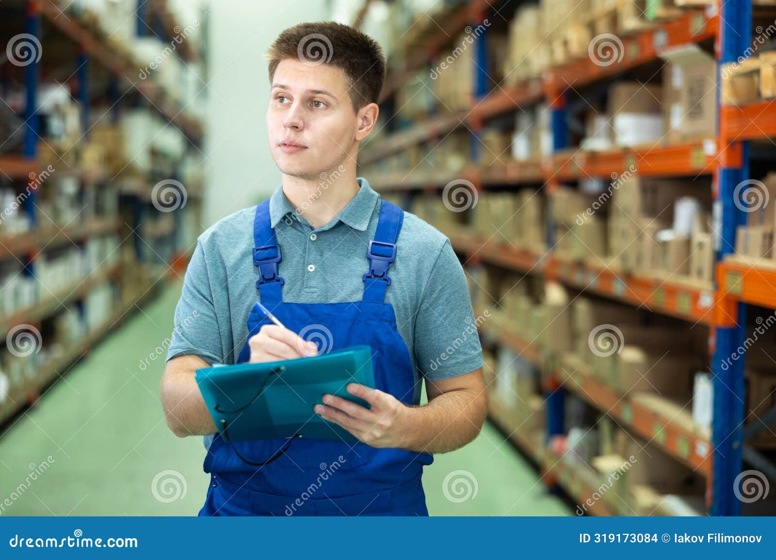 In Warehouse of Store, Guy Checks Quantity of Goods and Receipt ...