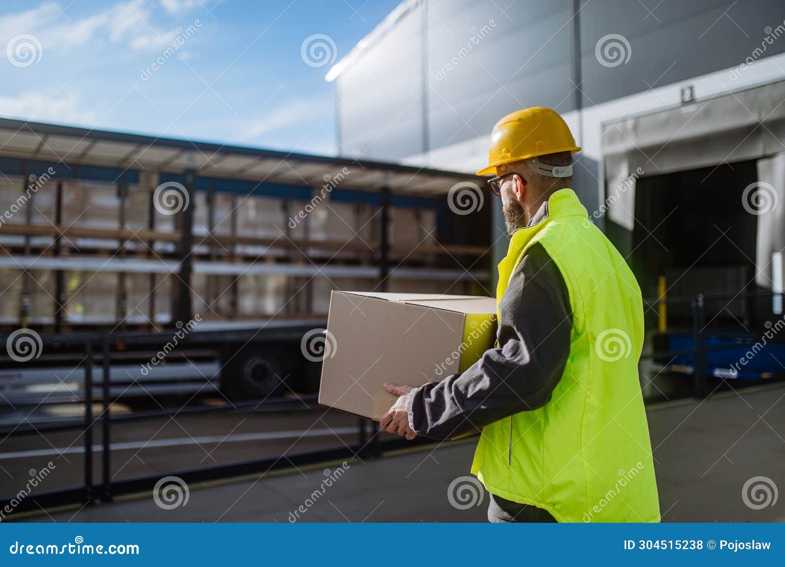 Warehouse Receiver Unloading Truck in Front of Warehouse, Carrying ...