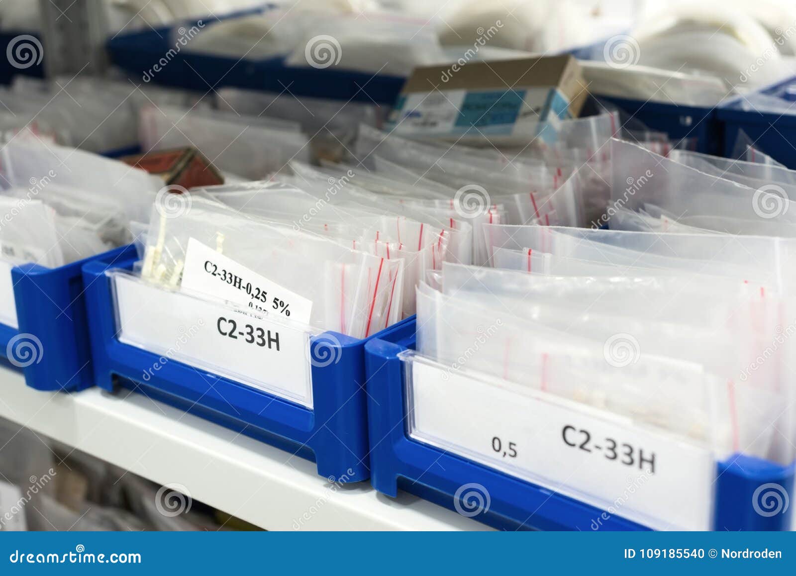 A Blue Plastic Container in Which There are Many Zip Packages. Stock ...