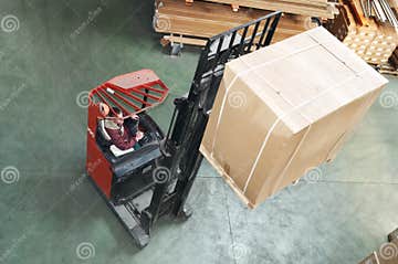 Warehouse stacker at work stock photo. Image of action - 19304628