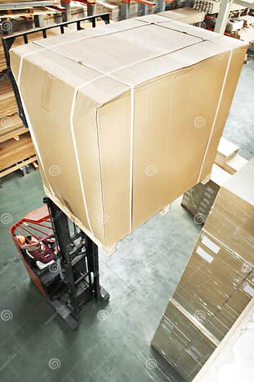 Warehouse stacker at work stock photo. Image of operator - 19304648