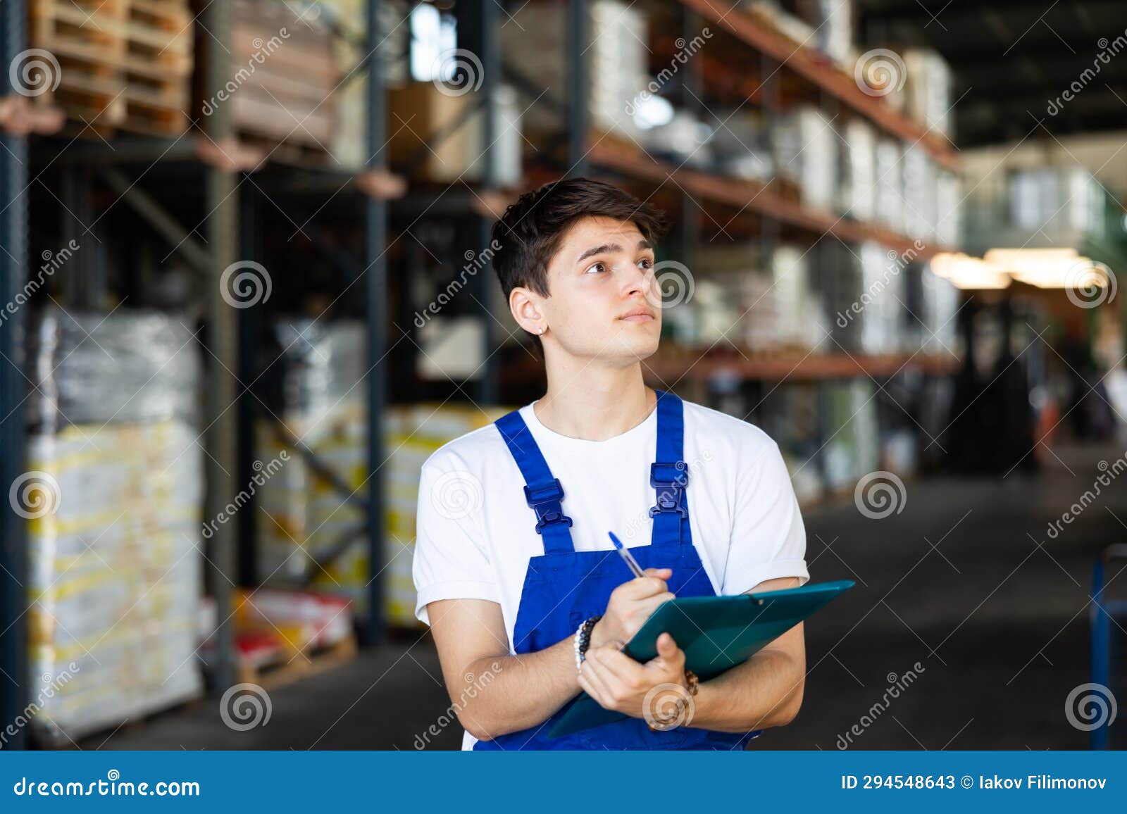 In Warehouse of Store, Guy Checks Quantity of Goods and Receipt ...
