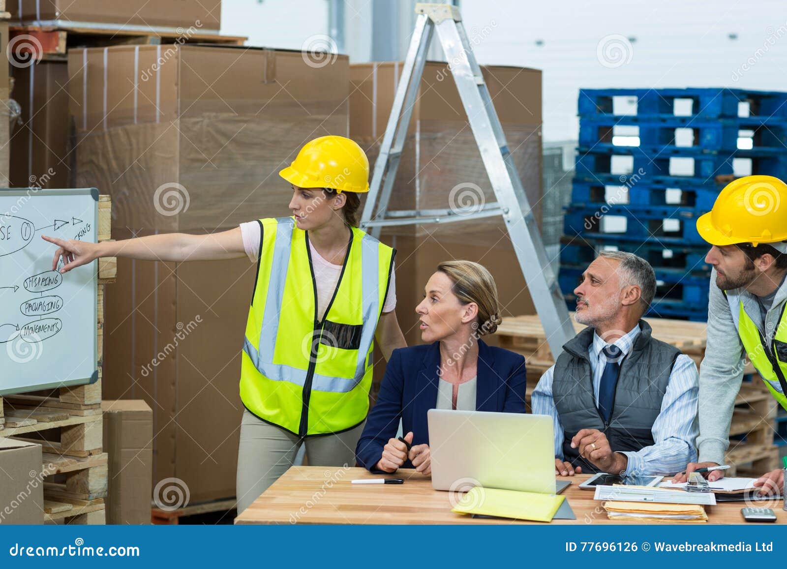 Warehouse Team Having a Meeting Stock Photo - Image of helmet, beard ...