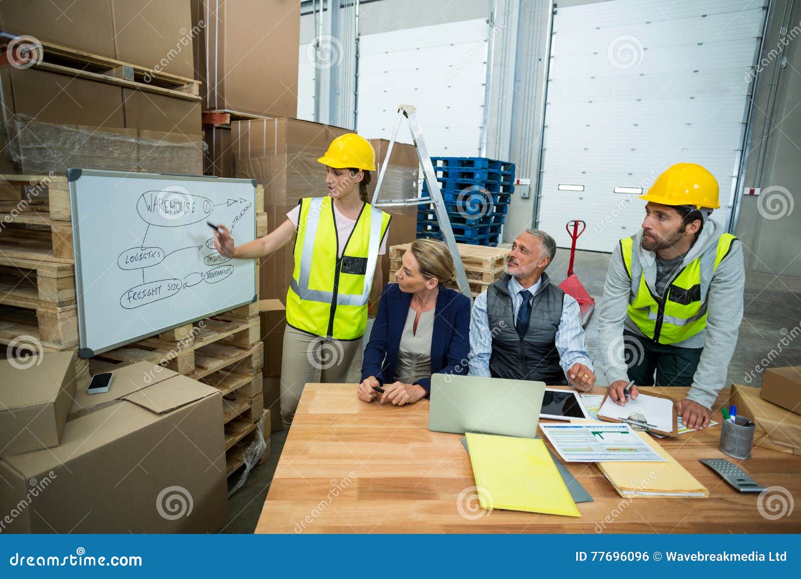 Warehouse Team Having a Meeting Stock Photo - Image of mature, helmet ...