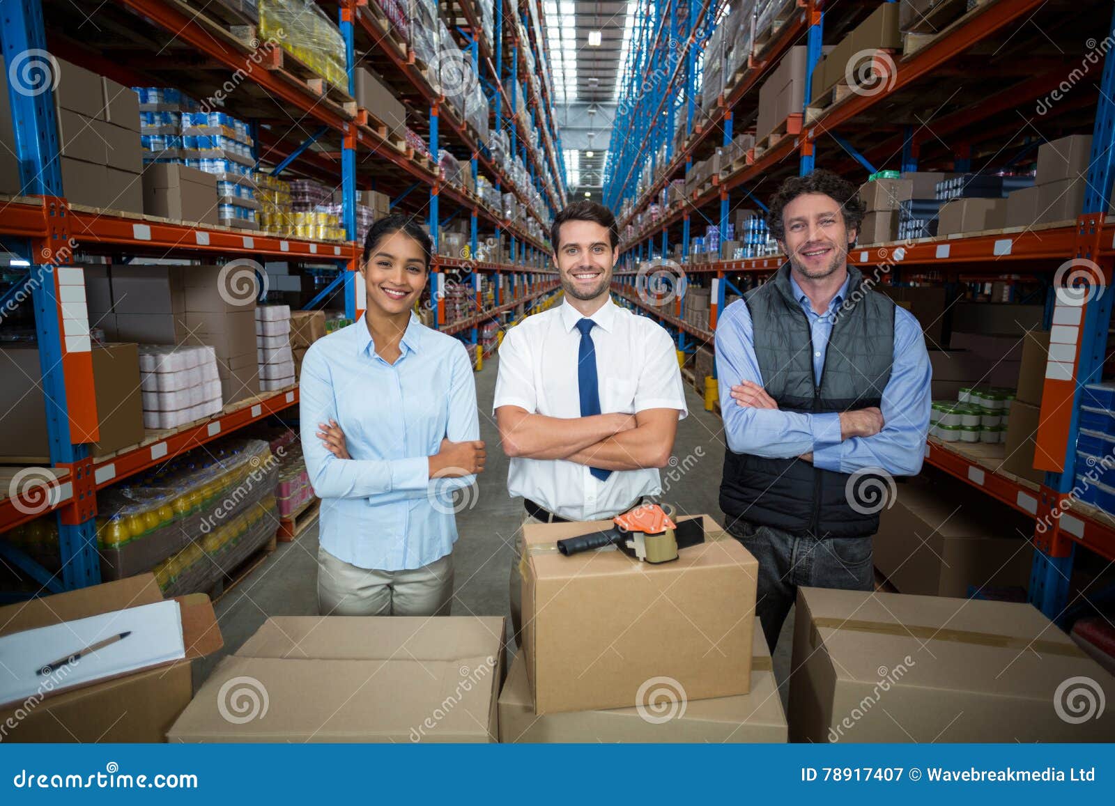 Warehouse Team Smiling at Camera Stock Image - Image of camera, goods ...