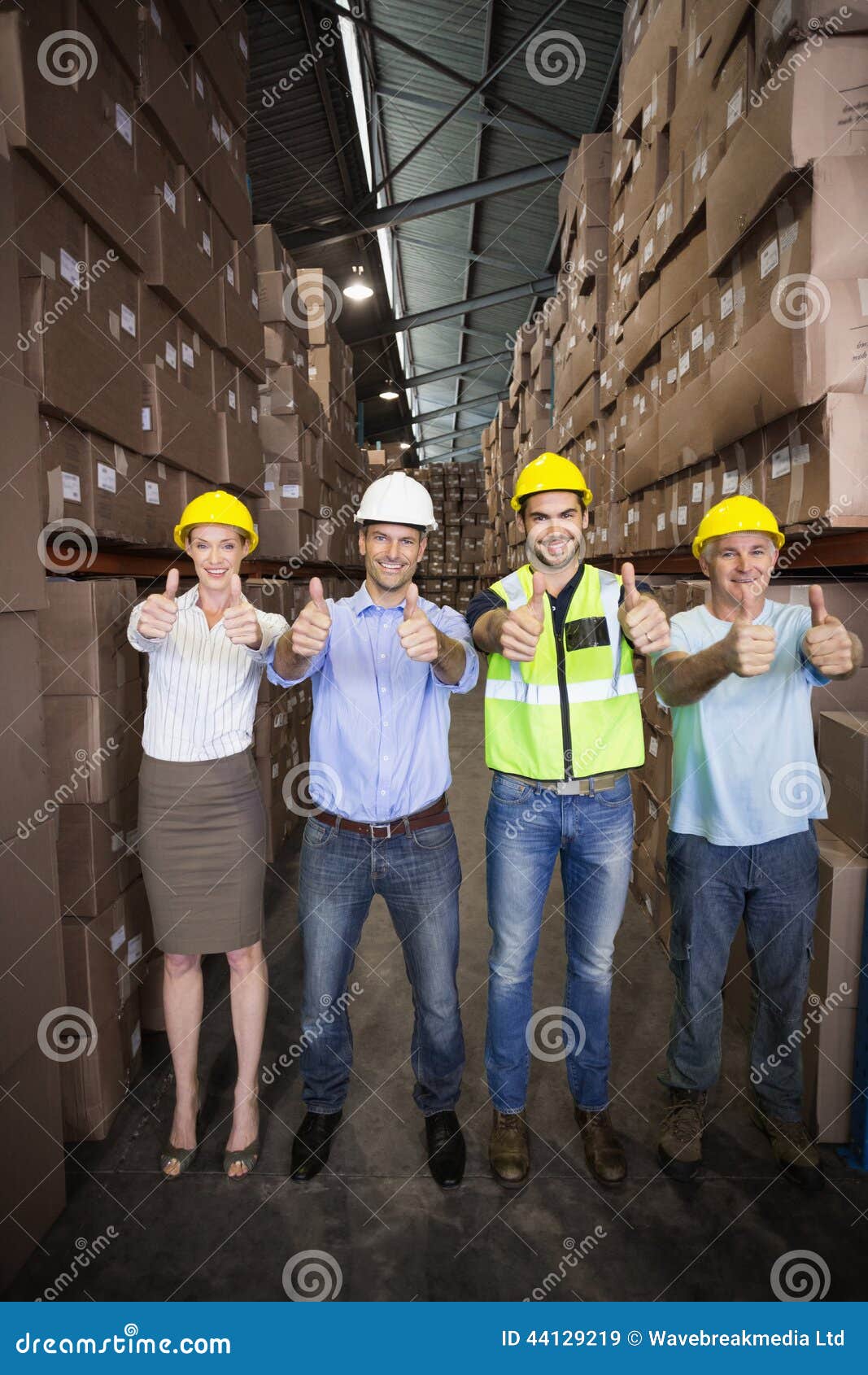 Warehouse Team Smiling at Camera Showing Thumbs Up Stock Image - Image ...
