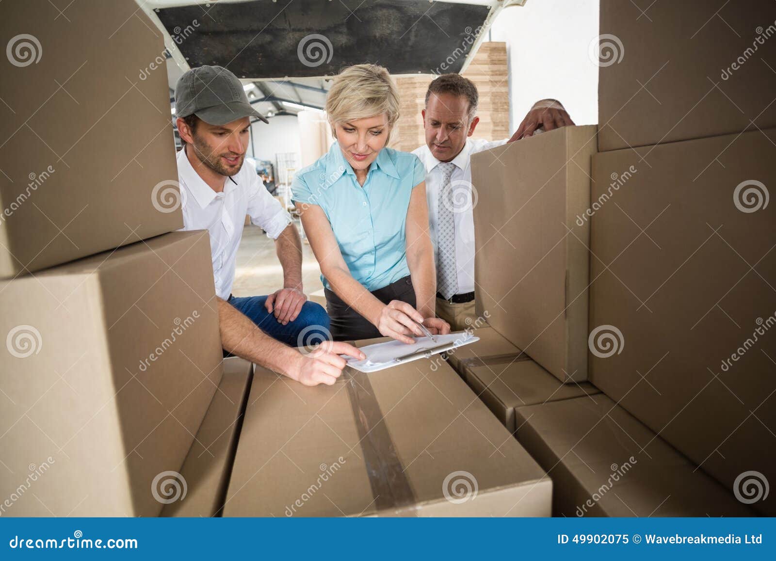 Warehouse Team Working Together with Clipboard Stock Image - Image of ...