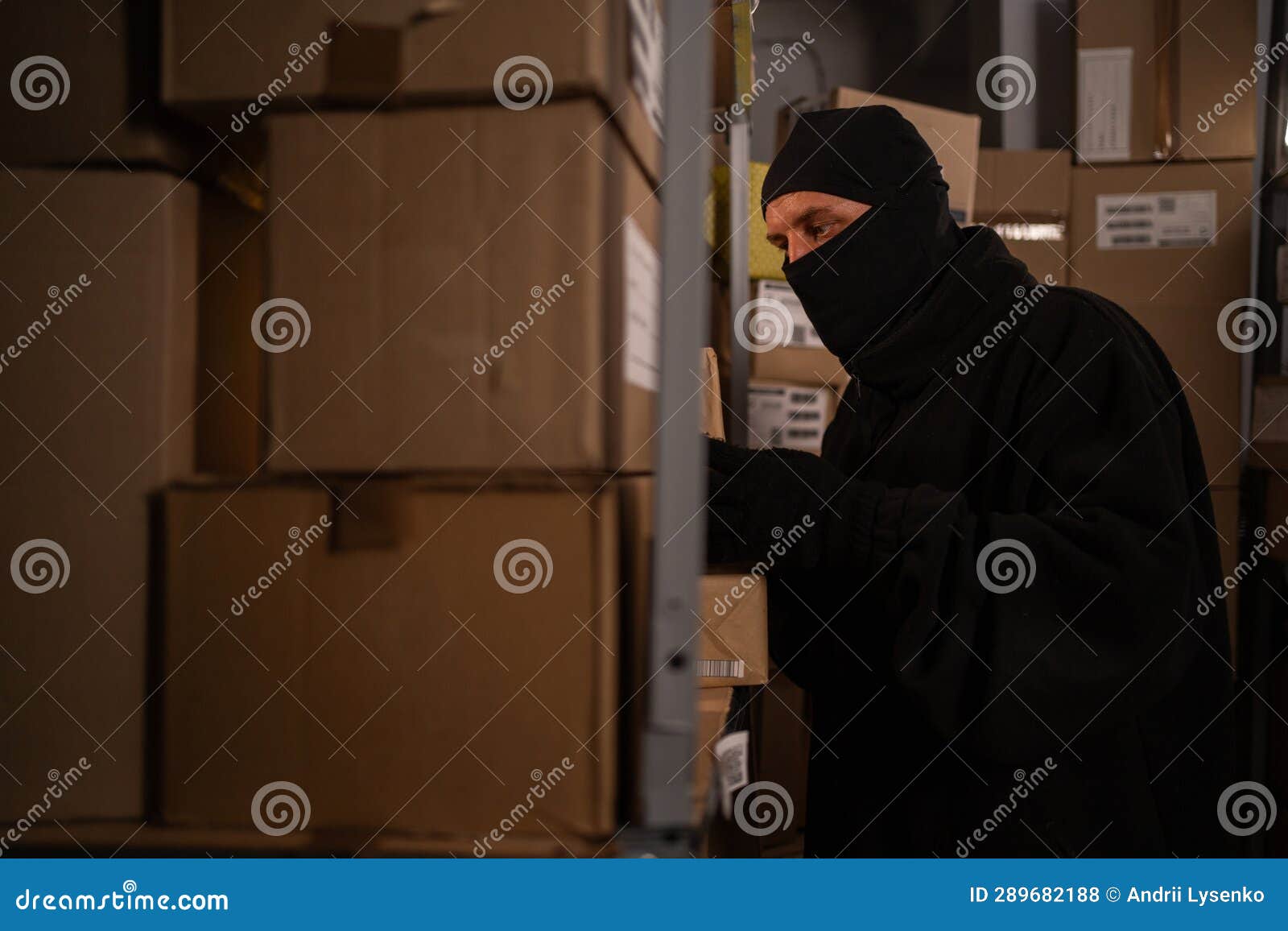 Warehouse Thief Stealing Boxes of Goods at Night. the Concept of ...