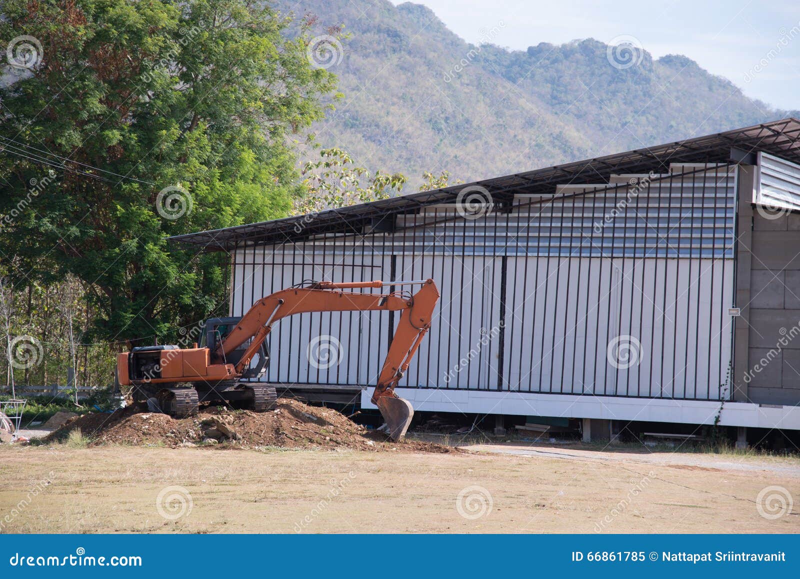 A Warehouse Under Construction in the Middle of the Mountain with Back ...