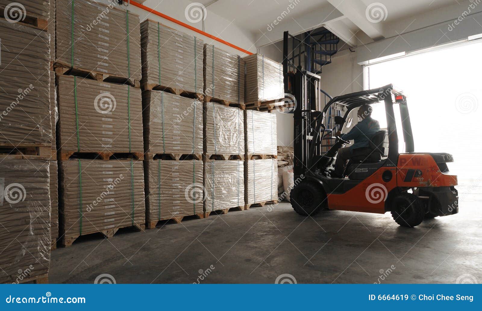 Warehouse Worker Unloading Package Box Out Of The Inside Cargo ...