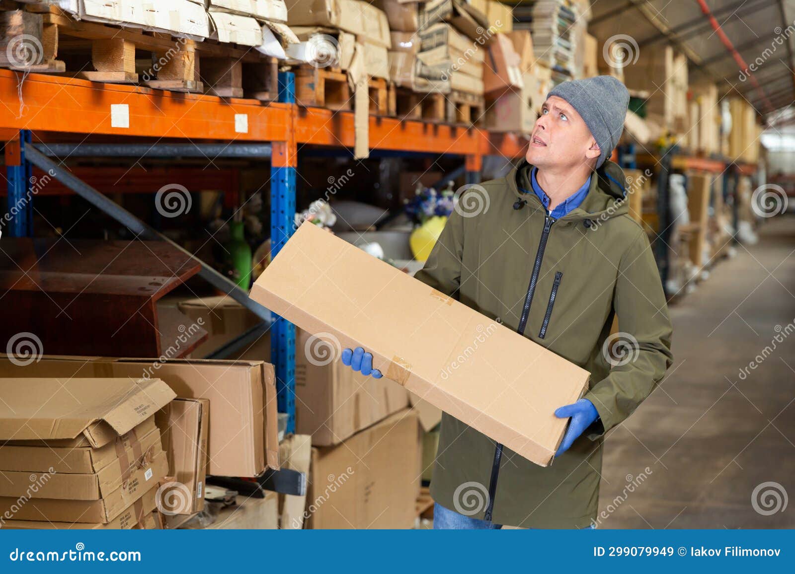 Warehouse Worker Carrying Boxes on Racks in in Warehouse Stock Image ...