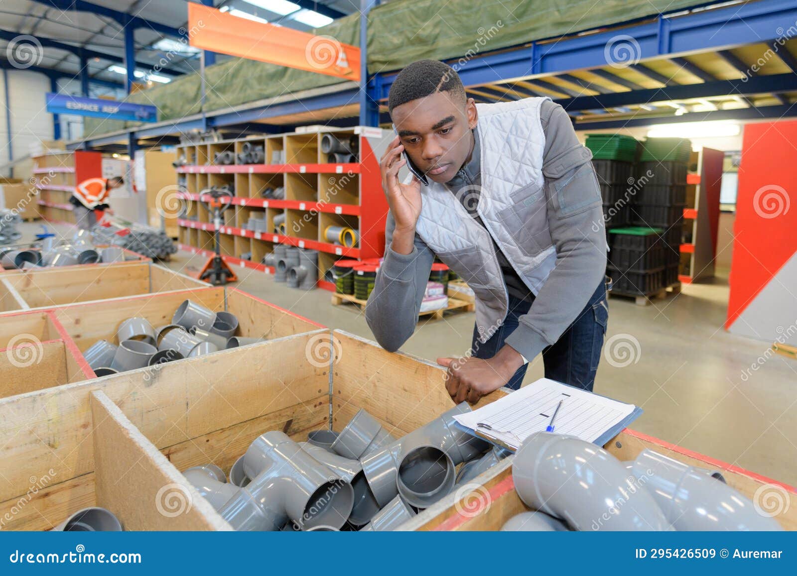Warehouse Worker Carrying Pipe in Warehouse Stock Image - Image of ...
