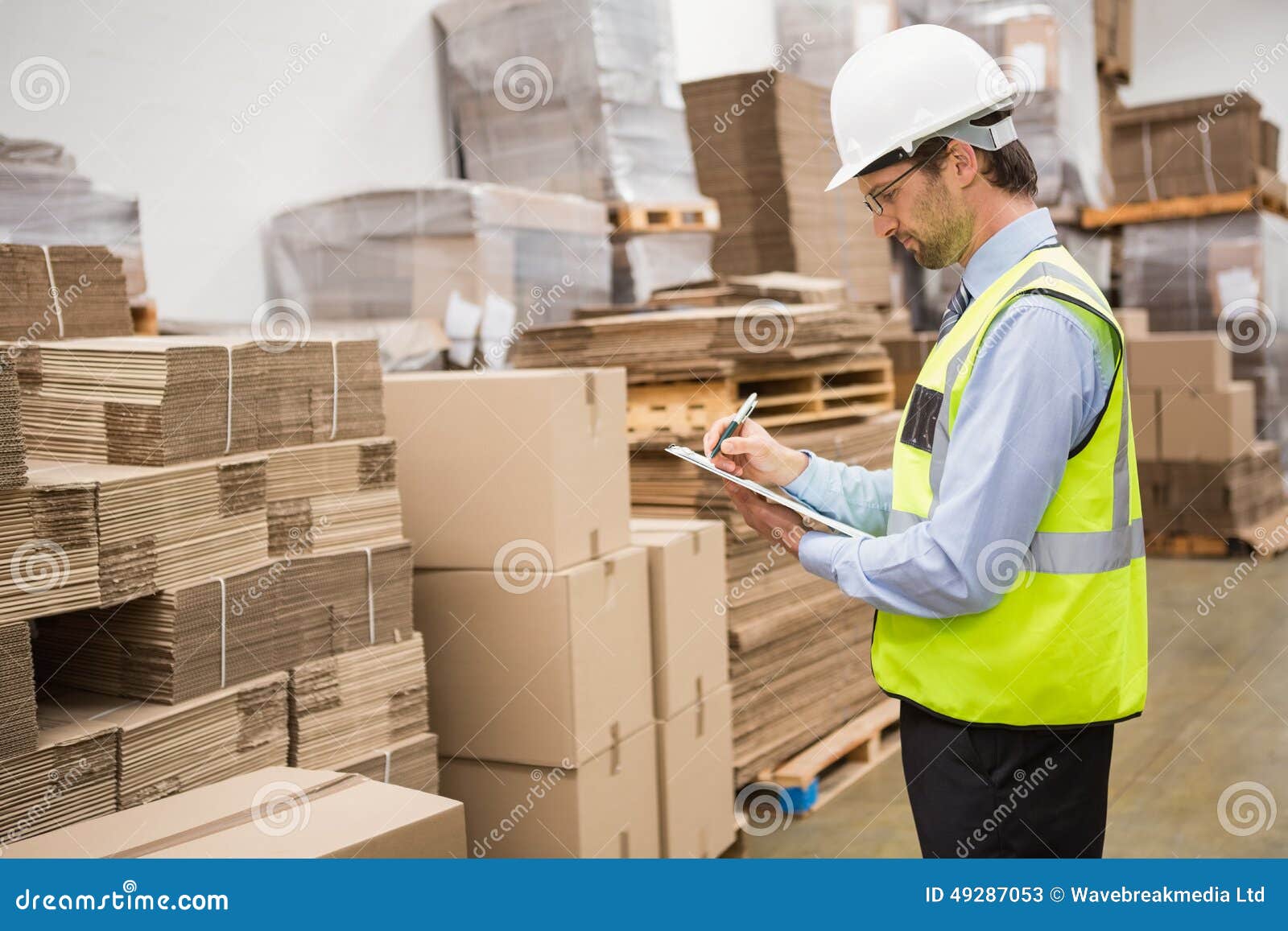 Warehouse Worker Checking His List on Clipboard Stock Image - Image of ...