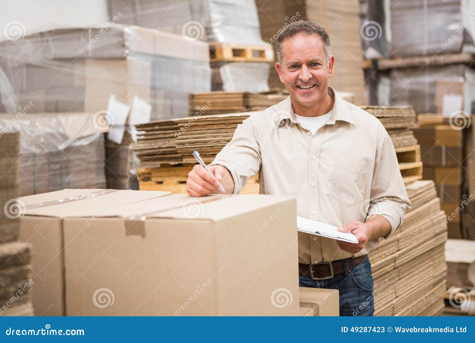 Warehouse Worker Checking His List on Clipboard Stock Image - Image of ...