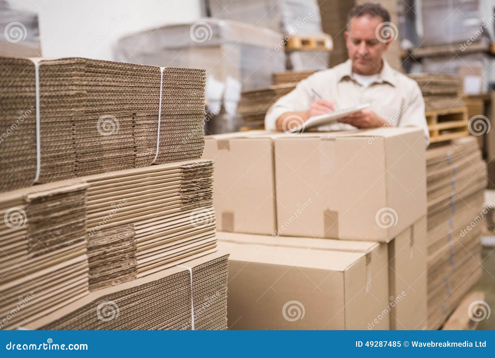 Warehouse Worker Checking His List on Clipboard Stock Image - Image of ...
