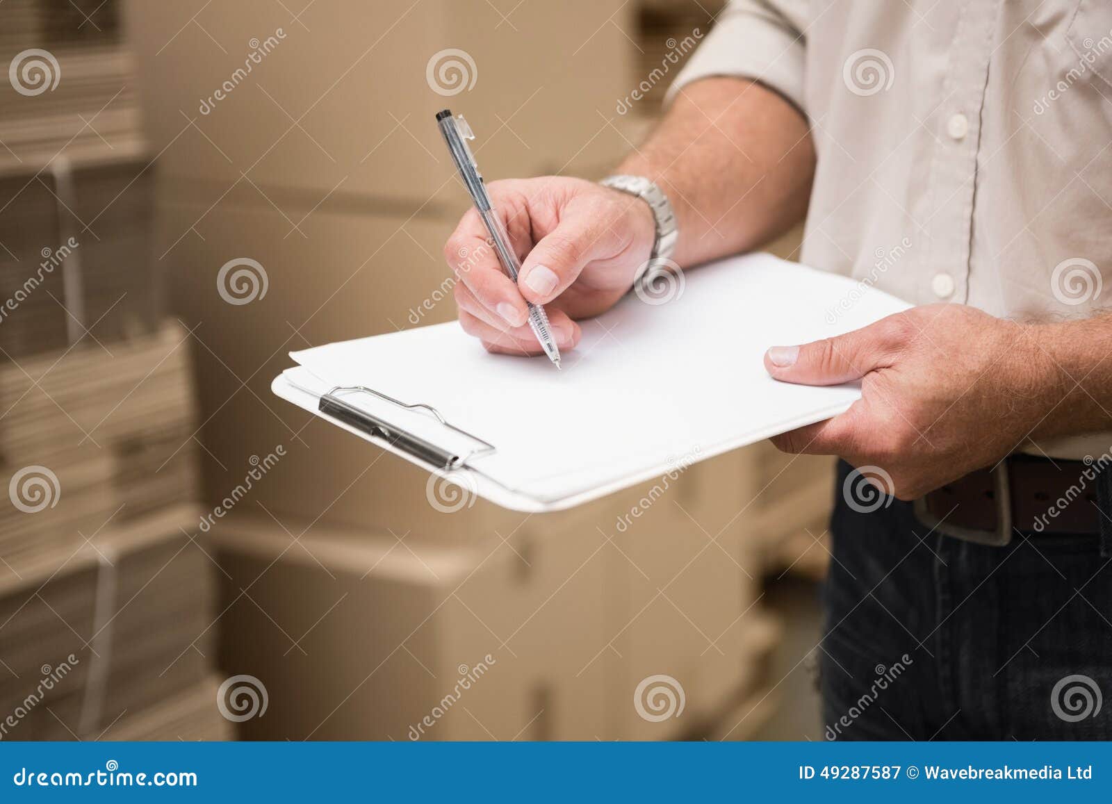 Warehouse Worker Checking His List on Clipboard Stock Image - Image of ...