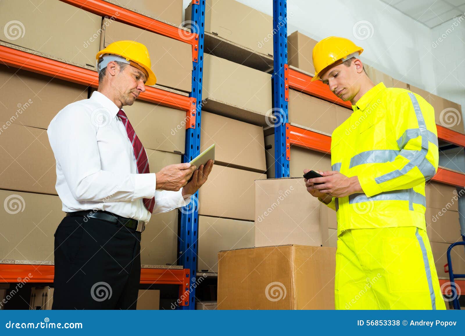 Warehouse Worker Checking the Inventory with Manager Stock Photo ... Warehouse Worker Checking the Inventory with Manager Stock Photo ...