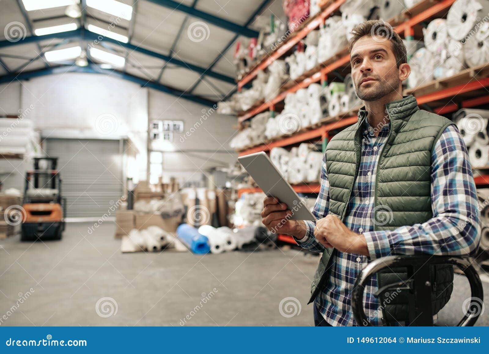 Warehouse Worker Checking Stock Using a Digital Tablet Stock Photo ...