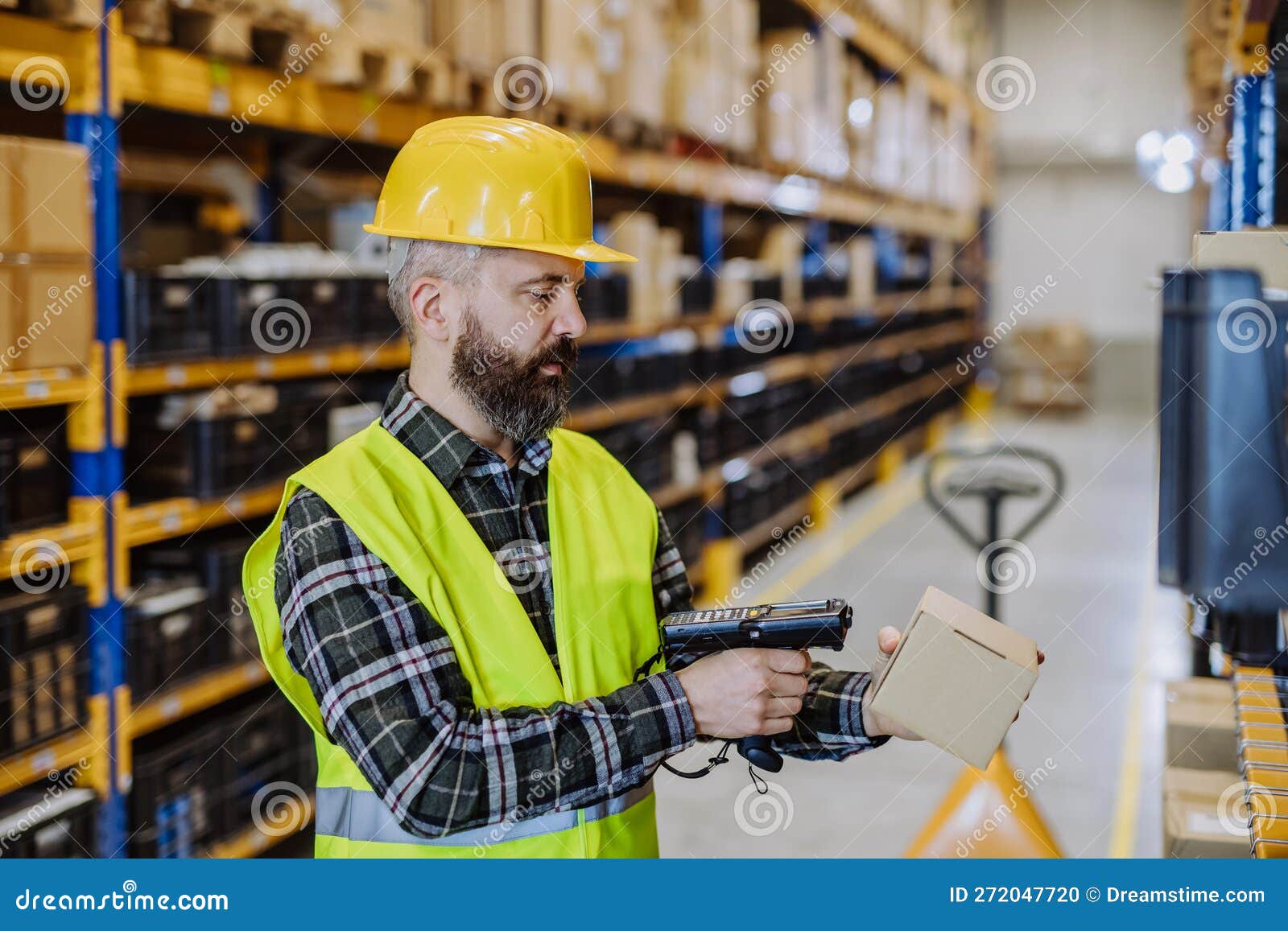 Warehouse Worker Checking Up Stuff in a Warehouse. Stock Photo - Image ...