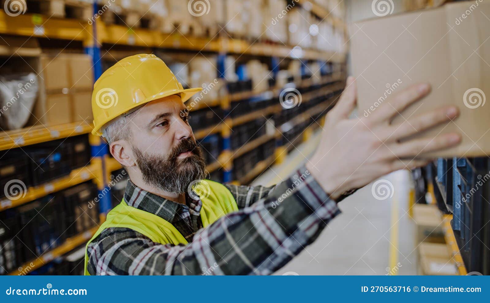 Warehouse Worker Checking Up Stuff in a Warehouse. Stock Photo - Image ...