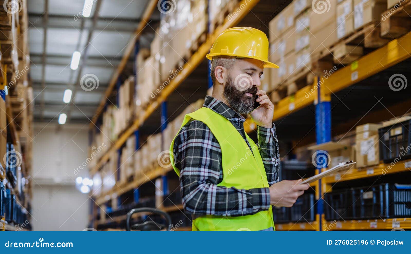 Warehouse Worker Checking Up Stuff in a Warehouse. Stock Photo - Image ...