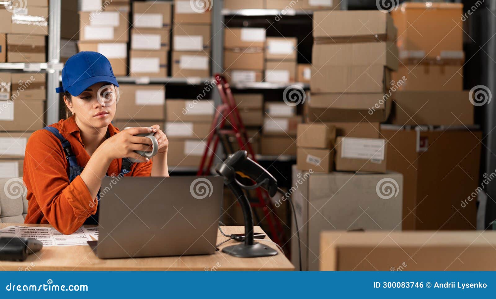 Warehouse Worker Drinking Tea or Coffee Working in Storeroom with Rows ...