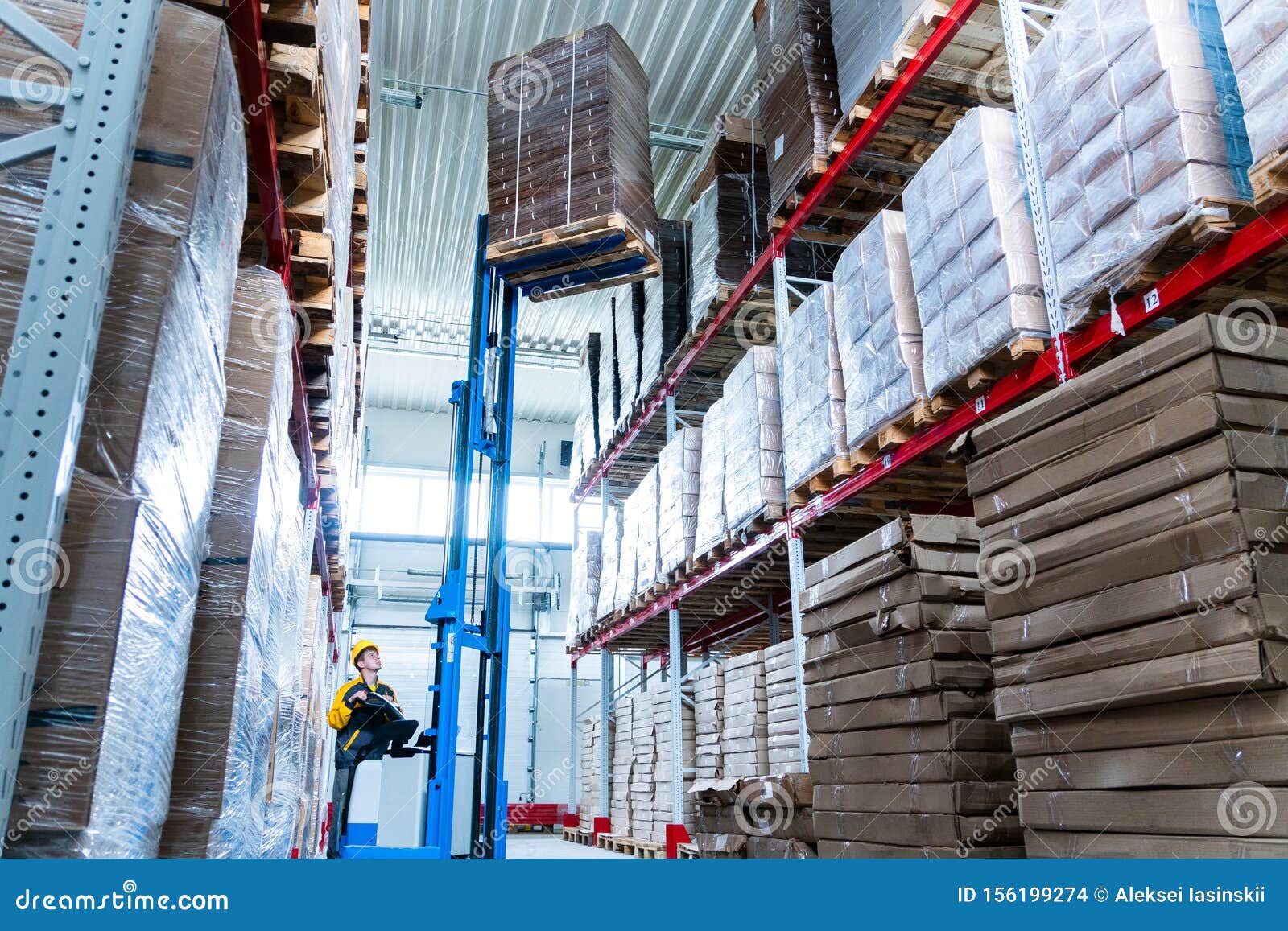 Warehouse Worker Driver in Uniform Delivery and Loading Cardboxes by ...