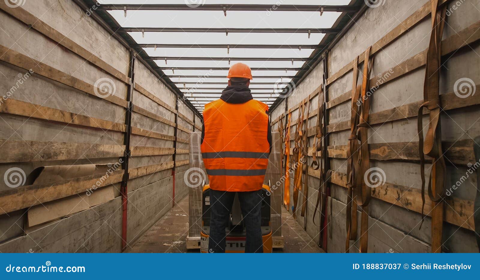 Warehouse Worker Driver in Uniform Loading Cardboard Boxes by Forklift ...