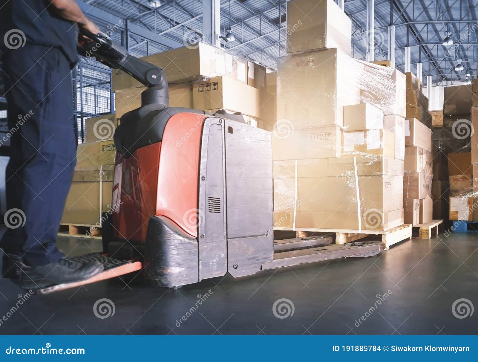 Warehouse Worker Driving Electric Forklift Pallet Jack Unloading ...