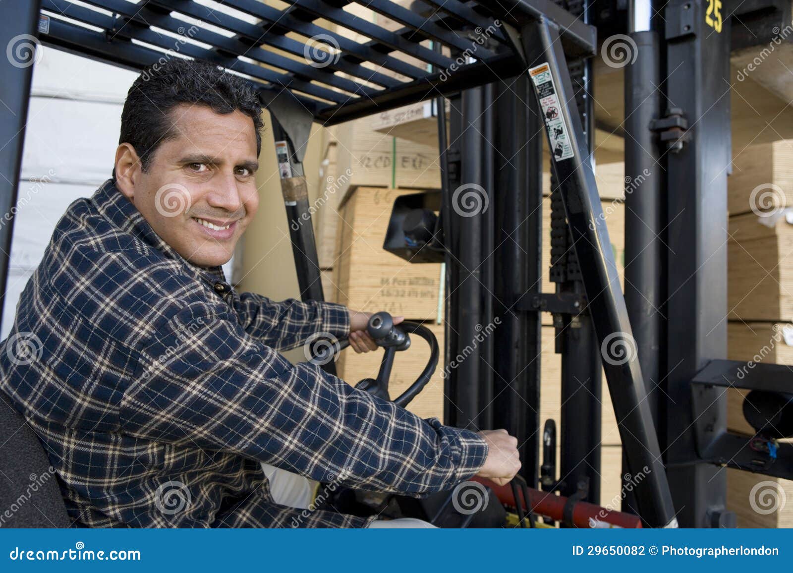 Worker Driving Forklift To Loading And Unloading Wooden Pallets From ...
