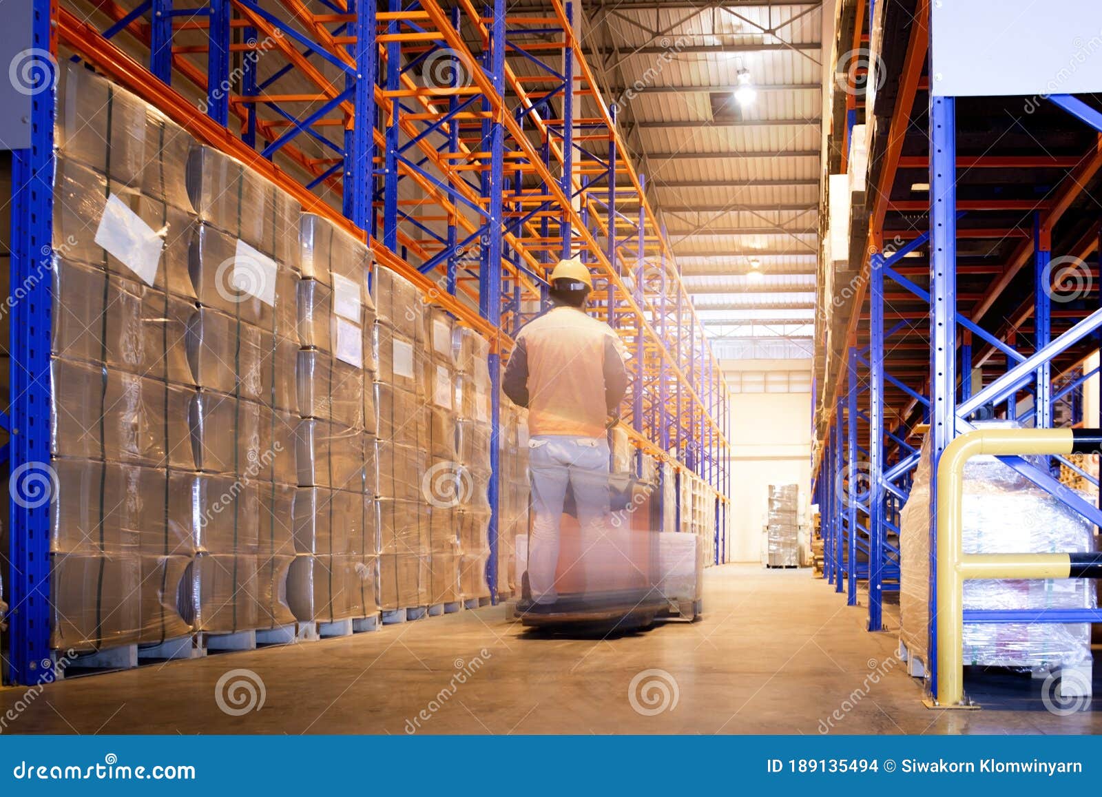 Warehouse Worker Driving Forklift Unloading Shipment Goods. Stock Photo ...