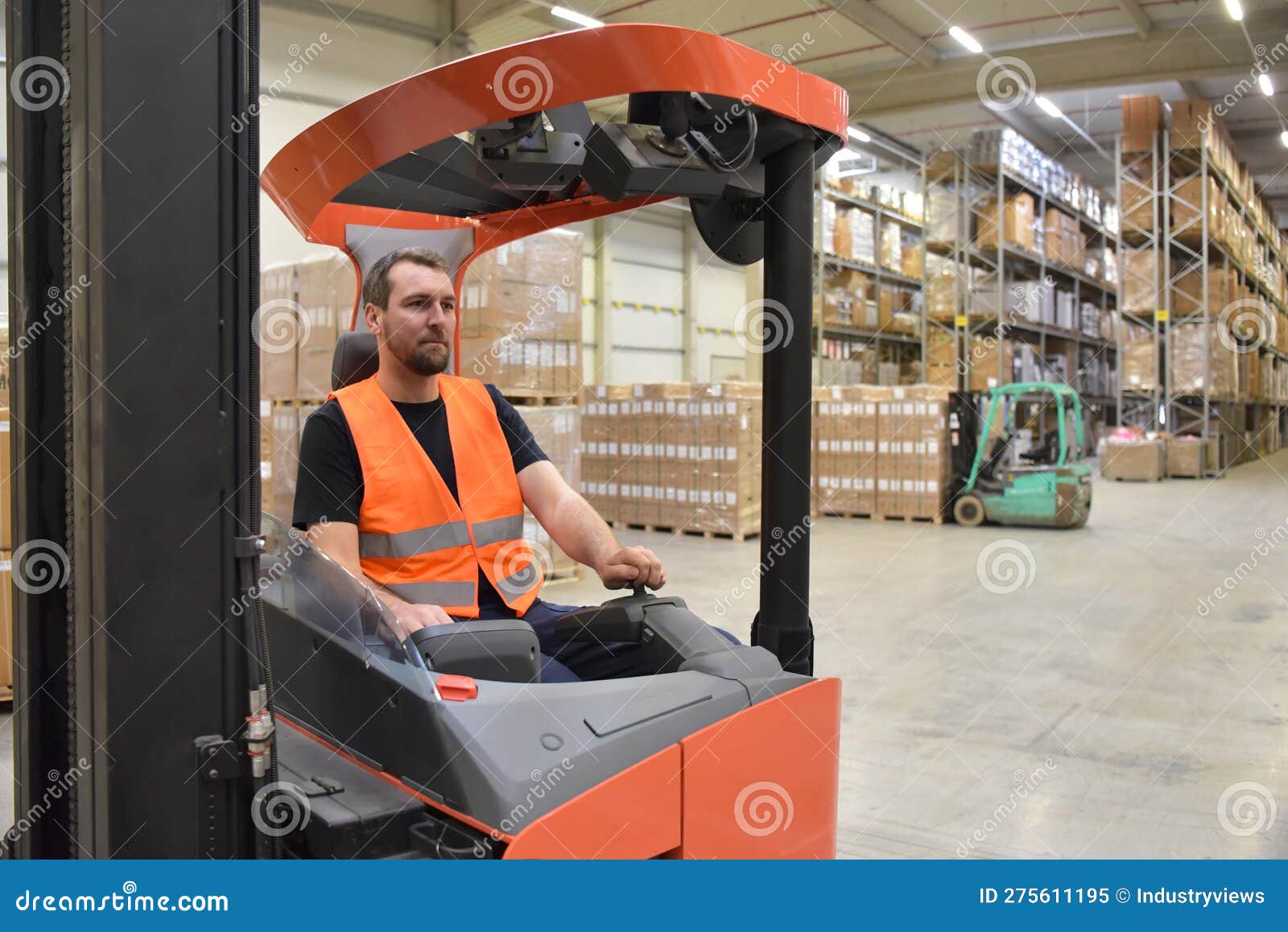 Warehouse Worker in a Forwarding Agency - Interior with Forklift ...