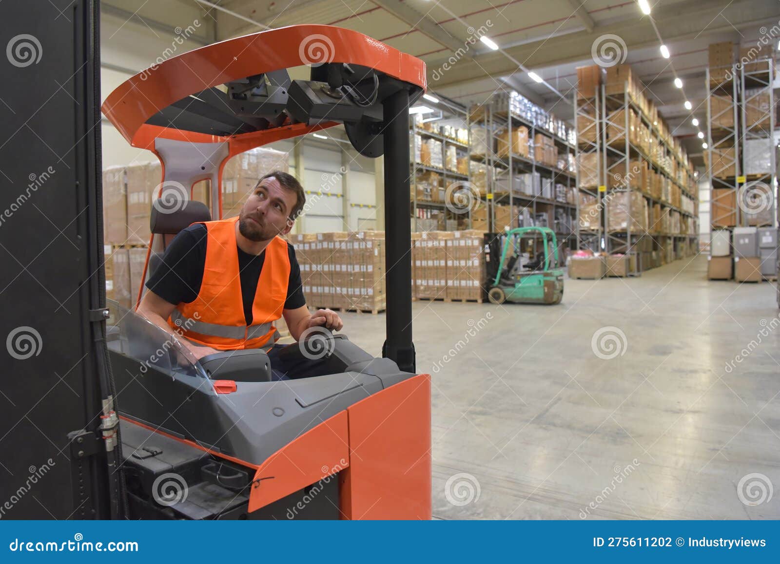 Warehouse Worker in a Forwarding Agency - Interior with Forklift ...