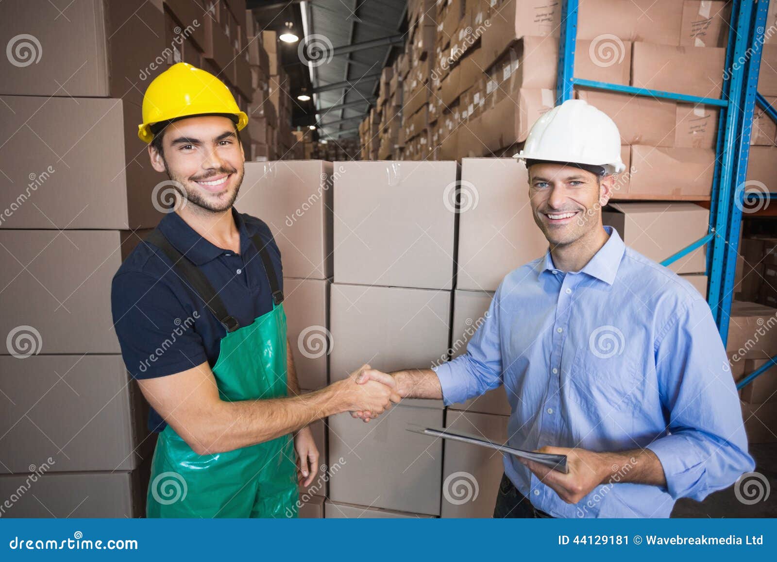 Warehouse Worker Loading Up a Pallet with Manager Stock Image - Image ...
