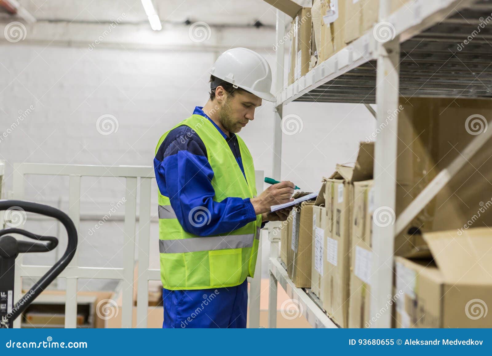 Warehouse Worker Looking at Documents Stock Image - Image of ...
