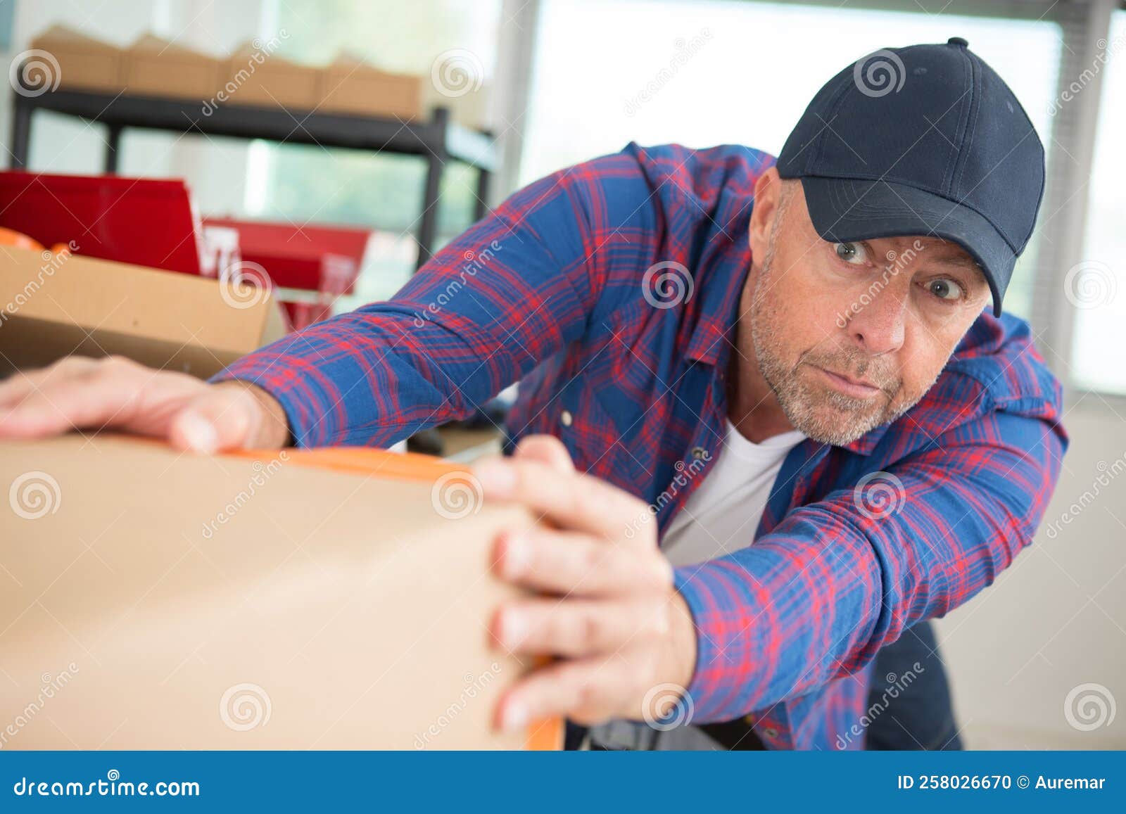 Warehouse Worker Moving Box Stock Photo - Image of distribution, moving ...
