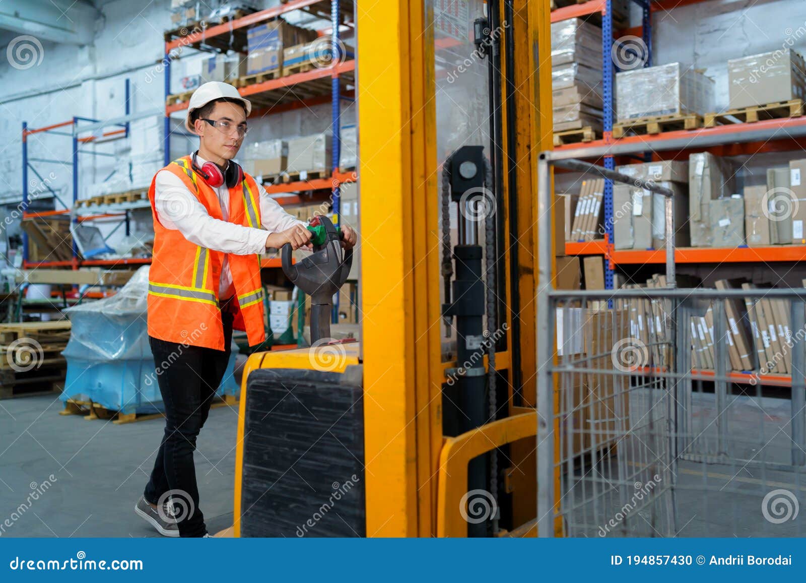 Warehouse Worker Operates a Pallet Loader. Stock Photo - Image of ...