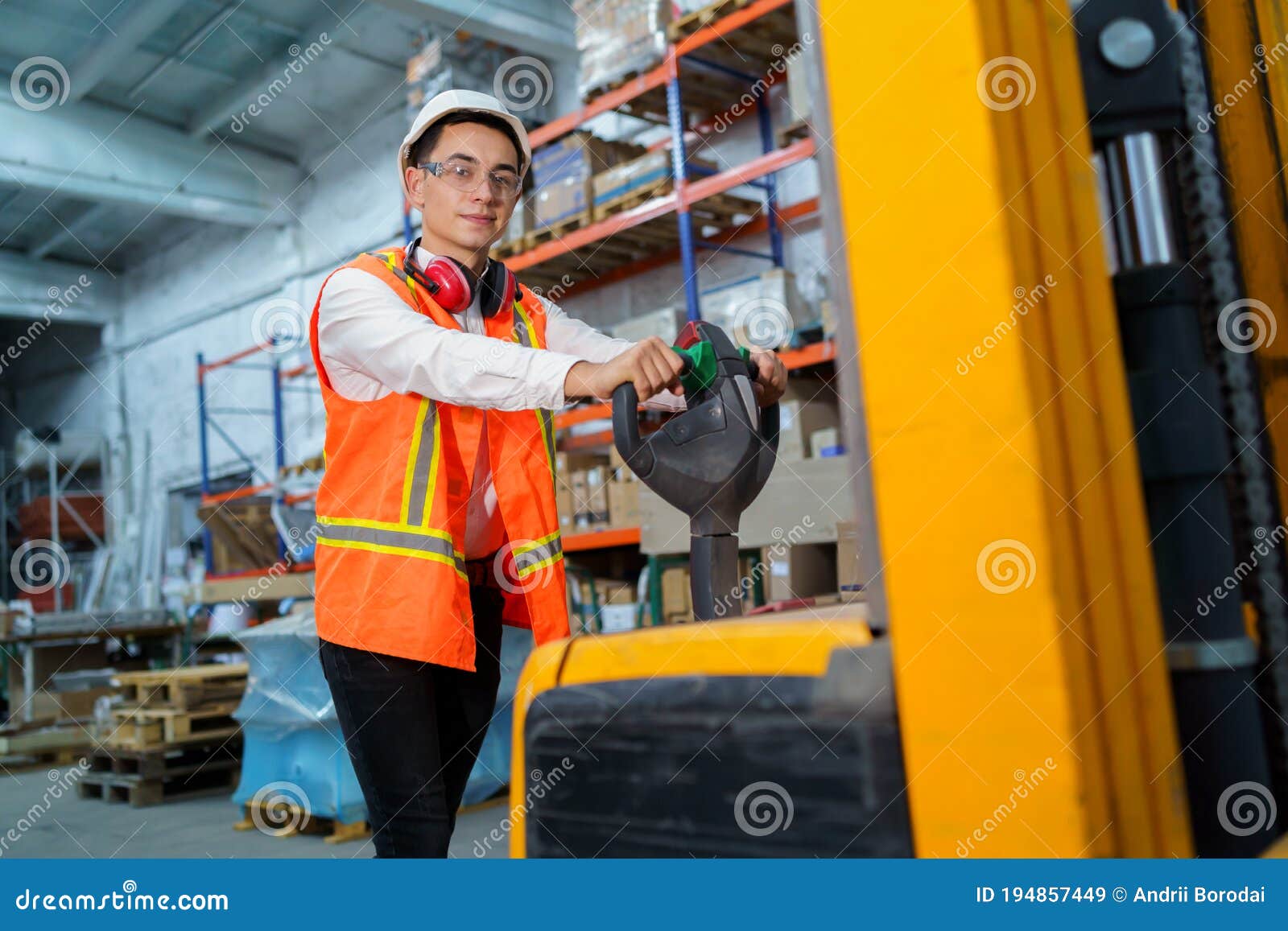 Warehouse Worker Operates a Pallet Loader. Stock Image - Image of ...