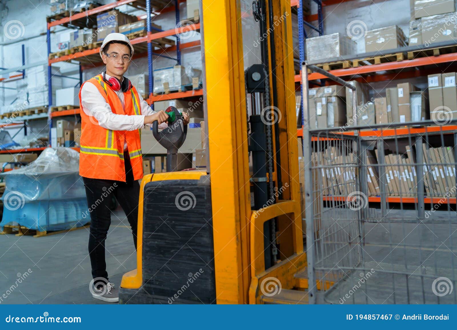 Warehouse Worker Operates a Pallet Loader. Stock Image - Image of ...