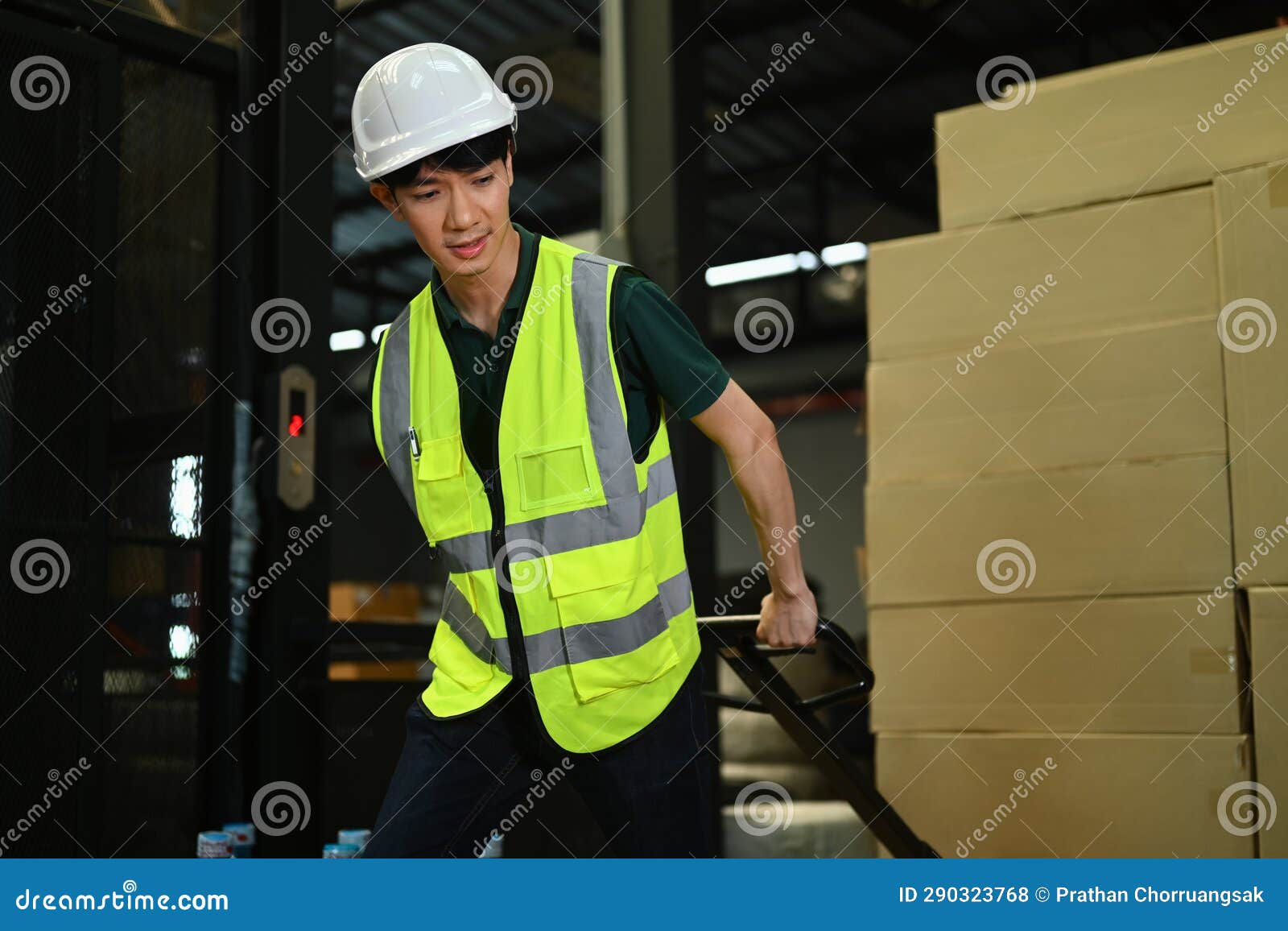 Warehouse Worker Pulling Pallet Truck Stack with Boxes. Shipping ...