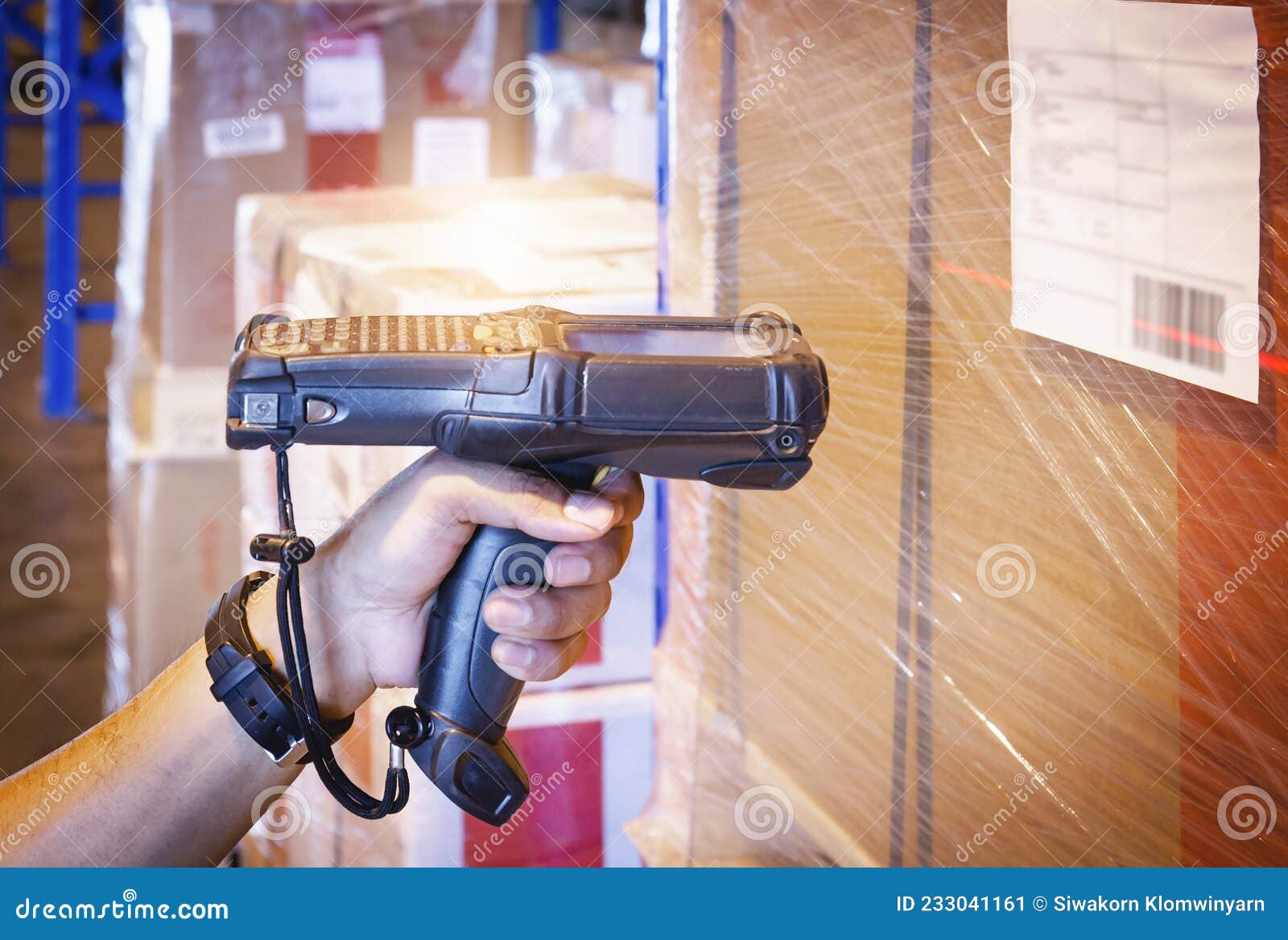 Warehouse Worker Scanning Bar Code Scanner with Package Boxes. Computer ...